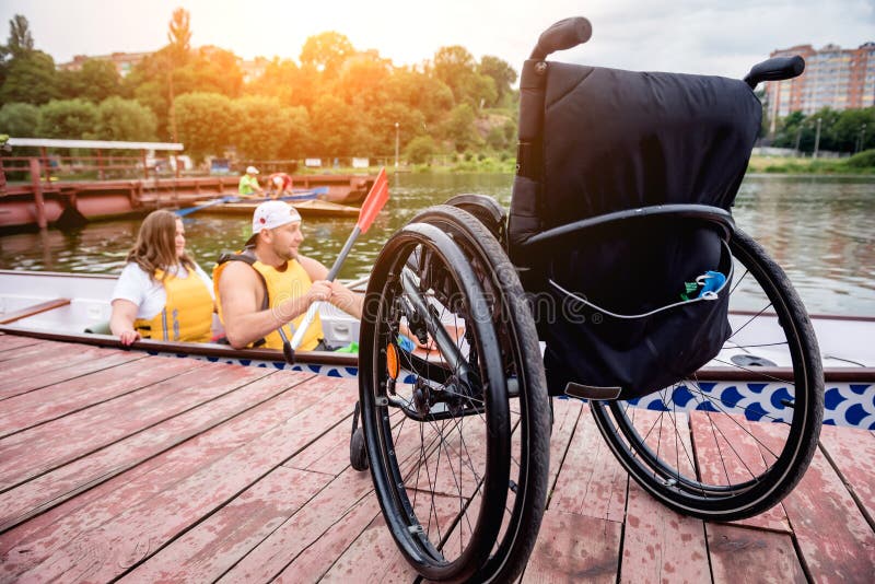 People with Disabilities Sail on a Rowing Boat. Stock Image - Image of ...