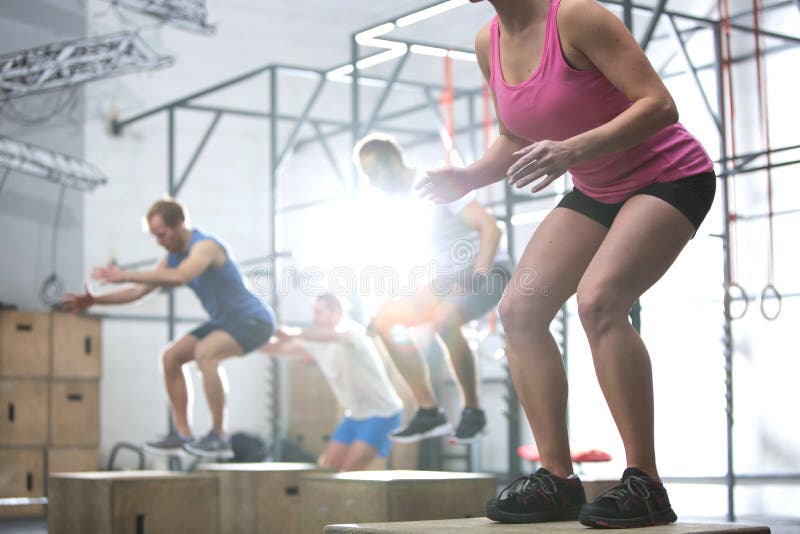 People Doing Box Jump Exercise in Crossfit Gym Stock Photo - Image of ...