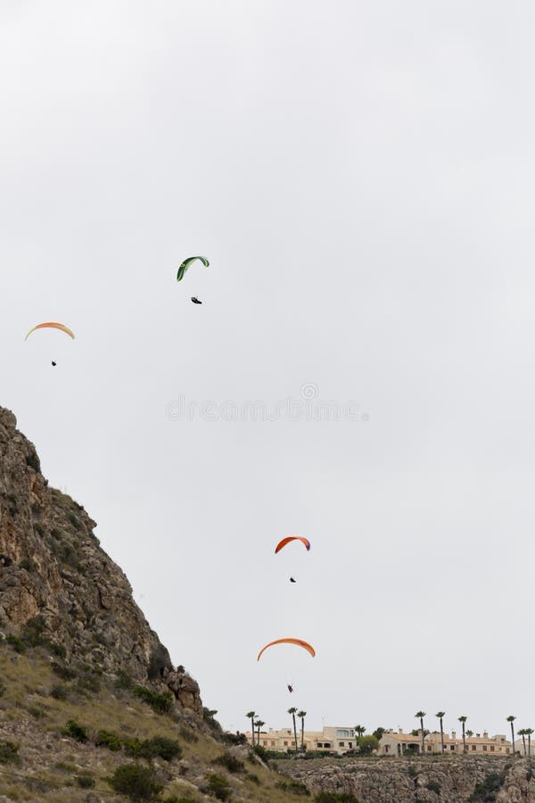 People doing paragliding stock photo. Image of paraglider - 76597928