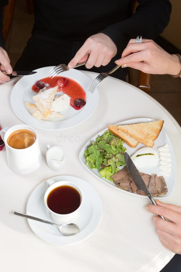 People Eating Breakfast in a Cafe Stock Photo - Image of meal ...