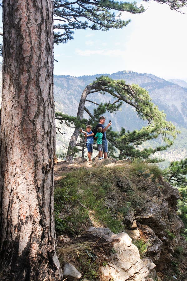 People on the Edge of the Cliff Editorial Photo - Image of clouds ...
