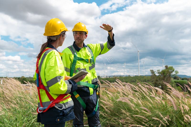 People Engineer are Wearing a Protective Helmet on Head, Using Tablet ...