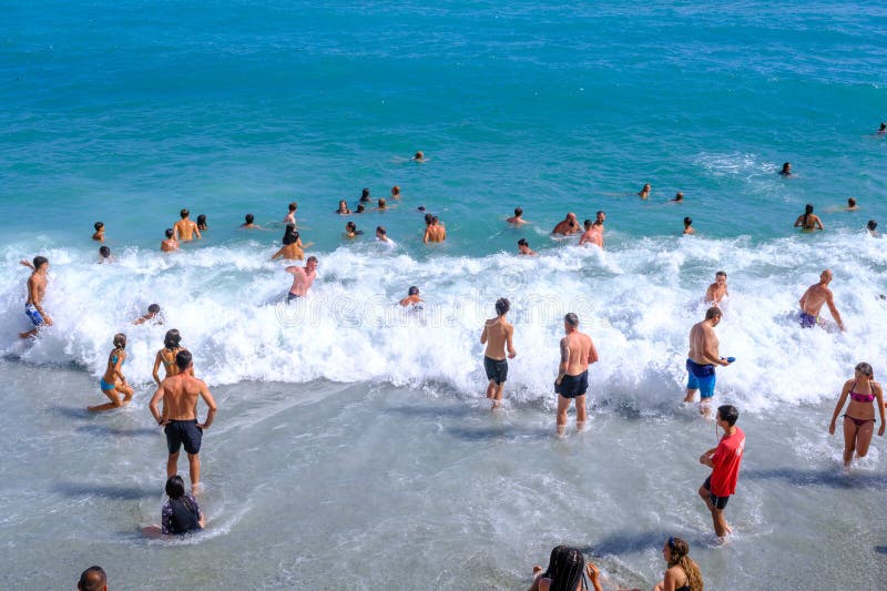 People Enjoying Big Waves at the Beach Editorial Image - Image of ...
