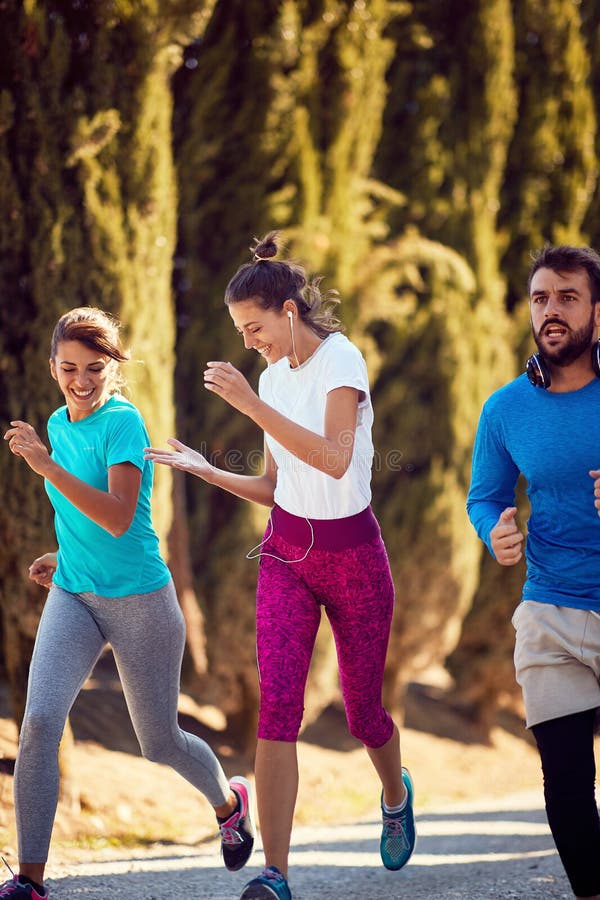 People Enjoying at Running Together Outdoors Stock Photo - Image of ...