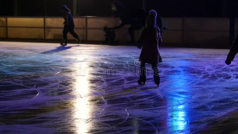 People Enjoying Skating on Night Illuminated Ice Rink Stock Video ...