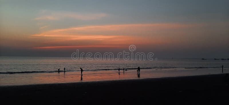 People Enjoying Sunset View at the Beach. Stock Photo - Image of ...