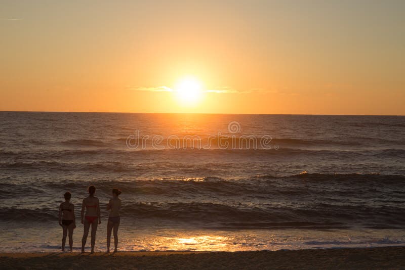 People Enjoying Their Time at the Sunrise on the Beach Stock Image ...