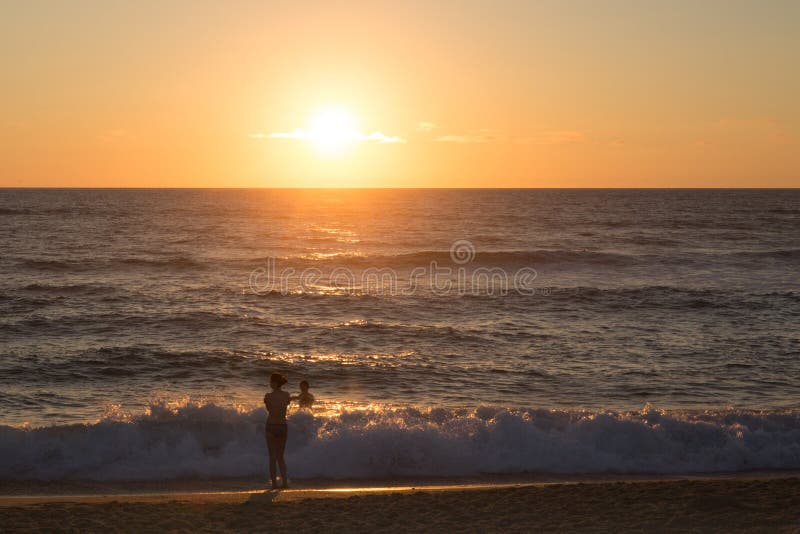 People Enjoying Their Time at the Sunrise on the Beach Stock Photo ...