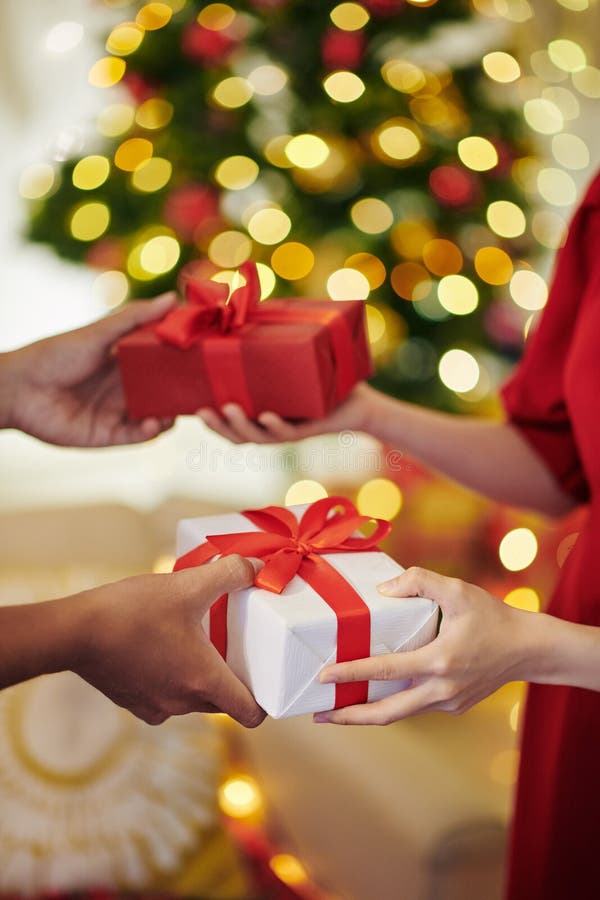 People Exchanging Christmas Gifts Stock Photo - Image of relationship ...