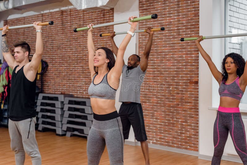 People Exercising with Bars Stock Image - Image of exercise, slim ...