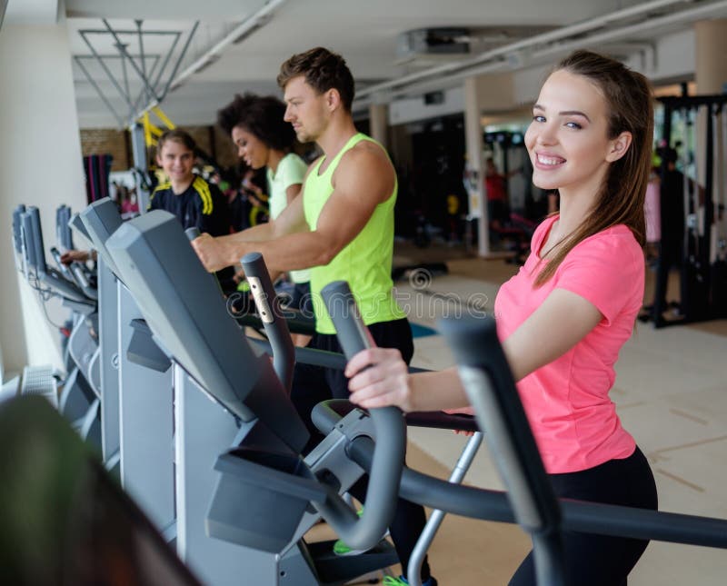 People Exercising on a Cardio Training Machines Stock Photo - Image of ...