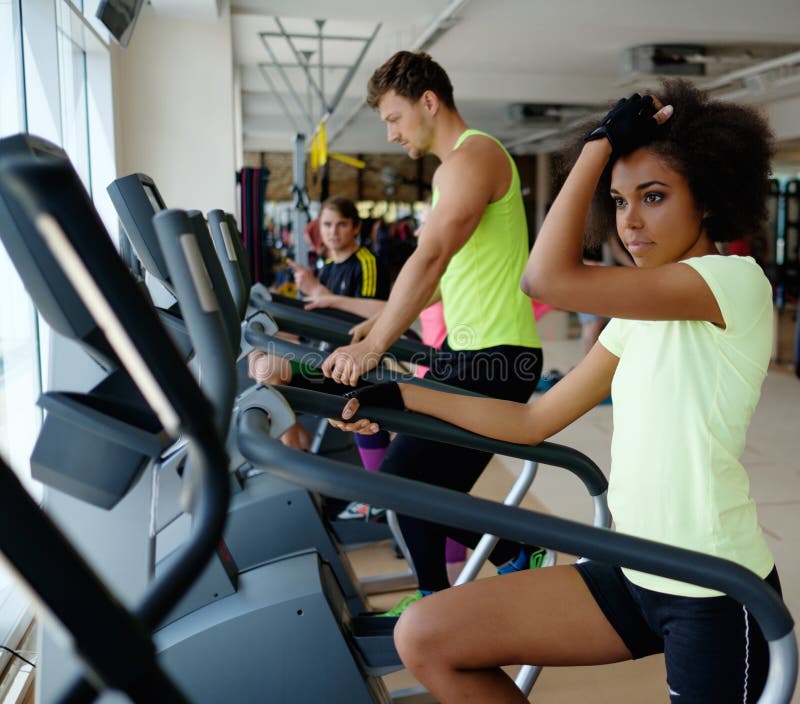 People Exercising on a Cardio Training Machines Stock Image - Image of ...