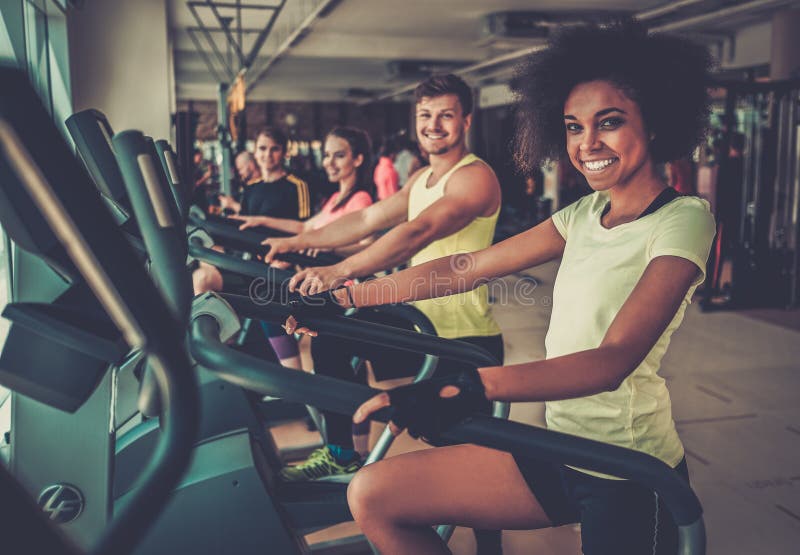 People Exercising on a Cardio Training Machines Stock Photo - Image of ...