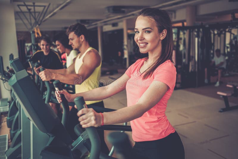 People Exercising on a Cardio Training Machines Stock Image - Image of ...