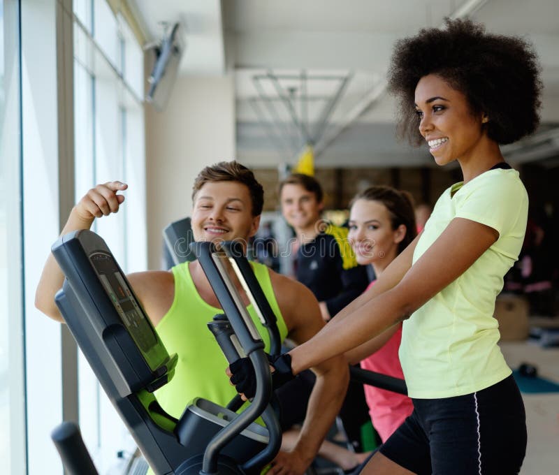 People Exercising on a Cardio Training Machines Stock Photo - Image of ...