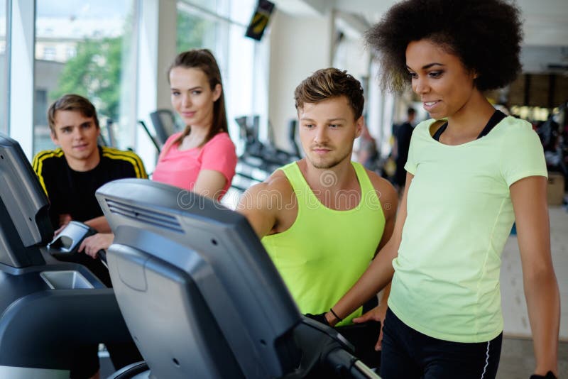 People Exercising on a Cardio Training Machines Stock Photo - Image of ...