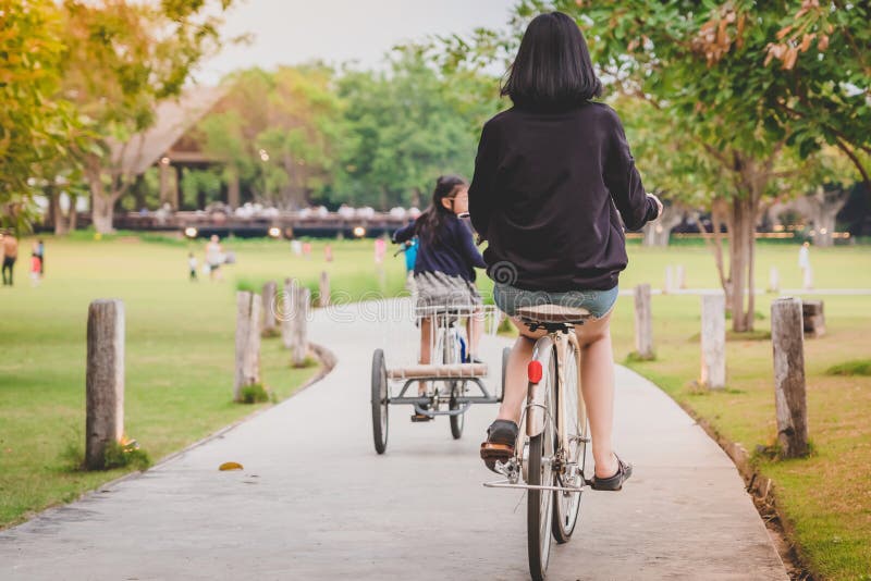 People Exercising by Cycling in the Evening Stock Photo - Image of kids ...