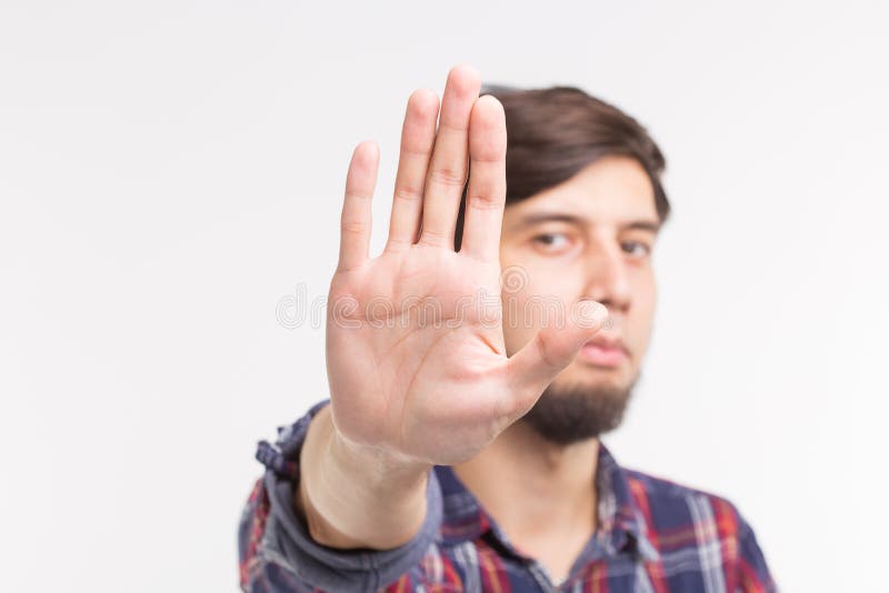 People, Expression and Gesture Concept - Young Man Showing Stop Gesture ...