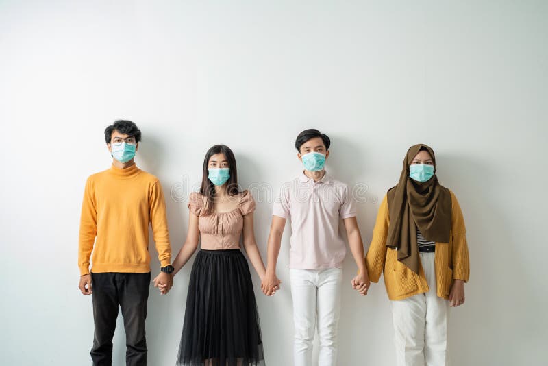 People with Face Masks Hold Hand Stock Photo - Image of fight, friend ...