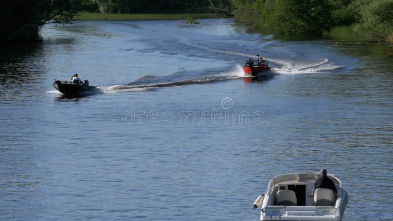 People on a Fast Motor Boat are Sailing Along the River in Slow Motion ...