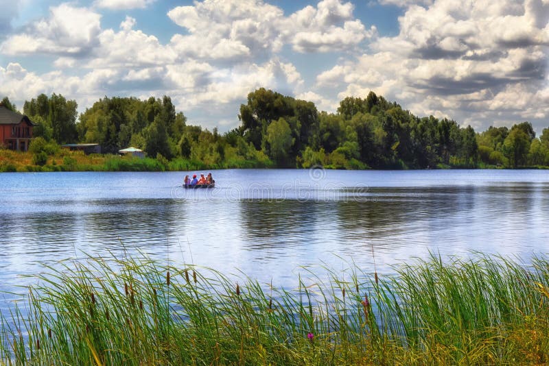 People Float in a Boat on a River Stock Photo - Image of person, boat ...