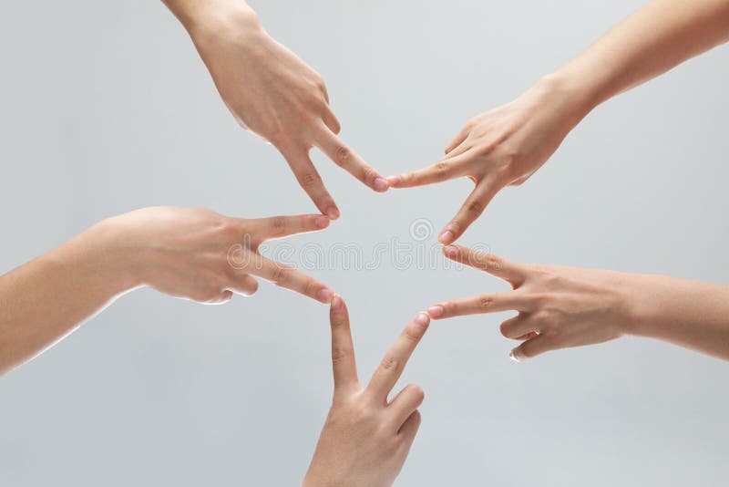 People Forming a Star Shape with Their Fingers. Concept of Teamwork ...