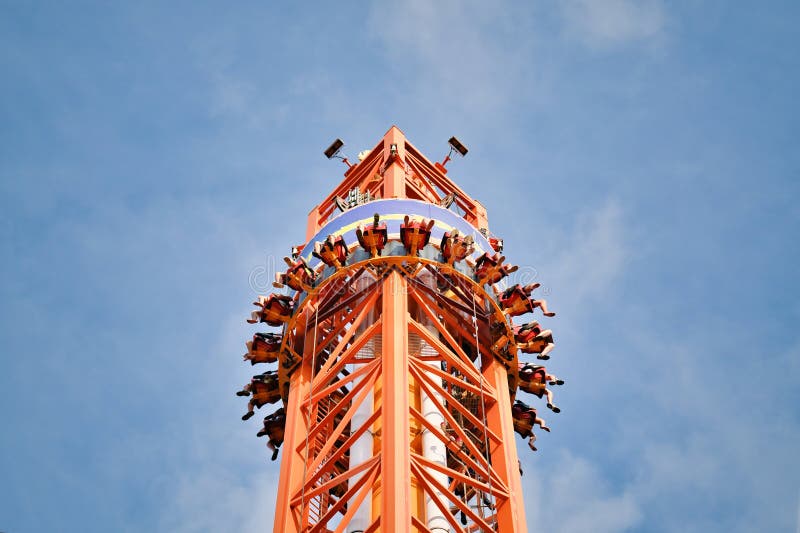People Free Falling from Tower Ride at Amusement Park. Free Fall Tower ...