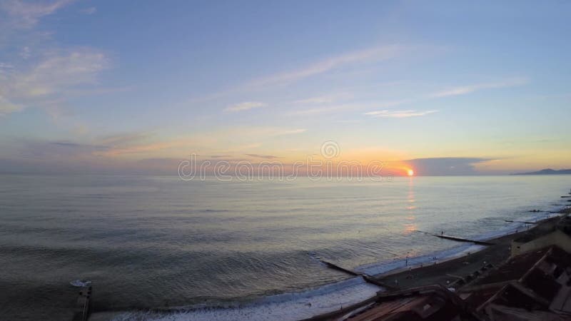People Get Rest on Sea Beach during Sunset. Aerial Stock Footage ...