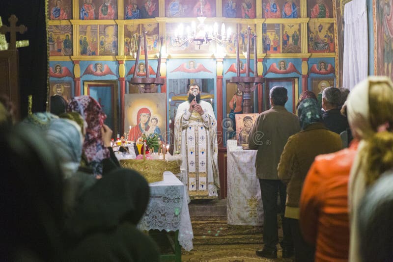 People Getting Light from the Priest in Easter Mass Stock Photo - Image ...