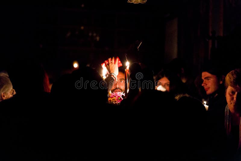 People Getting Light from the Priest in Easter Mass Stock Image - Image ...