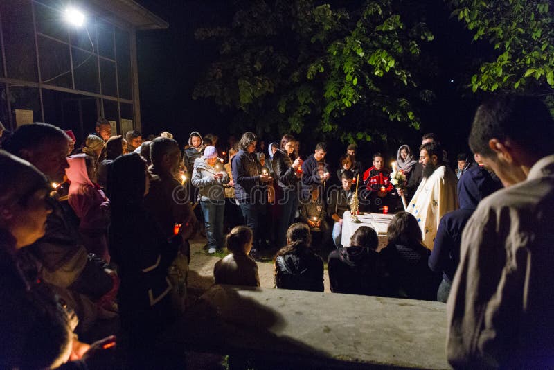 People Getting Light from the Priest in Easter Mass Stock Image - Image ...
