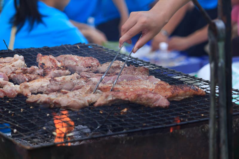 People are grilling pork stock photo. Image of barbecue - 42206618