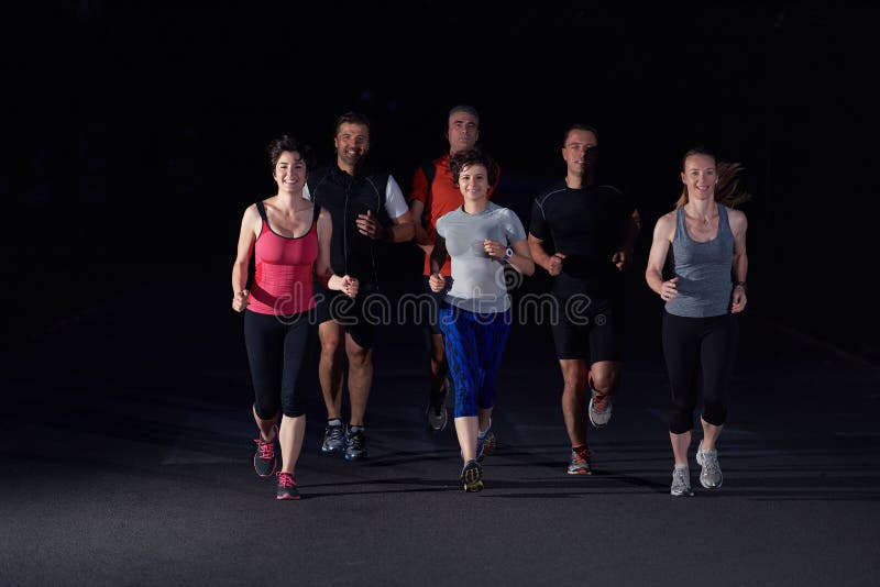 People Group Jogging at Night Stock Image - Image of park, healthy ...