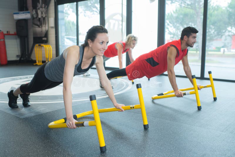 People in Gym Class Leaning on Apparatus in Plank Position Stock Image ...