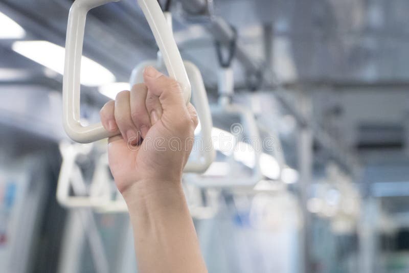 People Hand Holding Handle on the Train during Rush Hour.Handle Loop in ...
