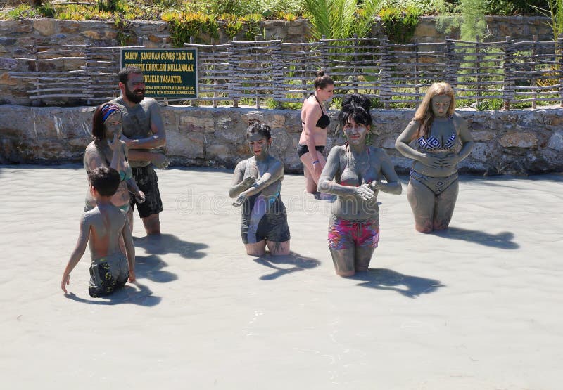 People having mud bath editorial image. Image of pose - 102798240