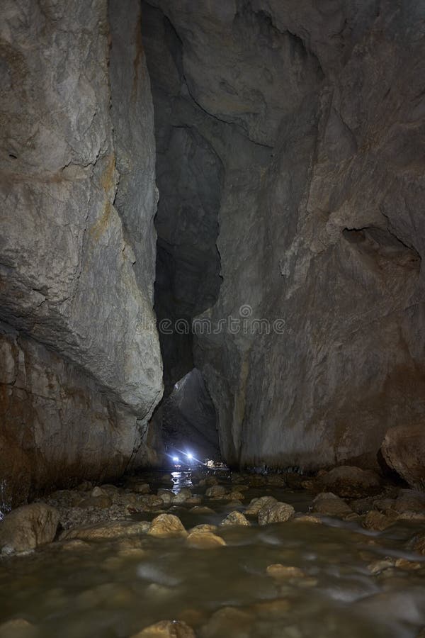 People with Headlamps Exploring a Cave Stock Image - Image of lamp ...