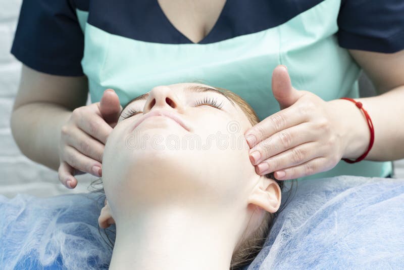 Master Cosmetologist In A Beauty Salon Makes An Anti Stress Facial