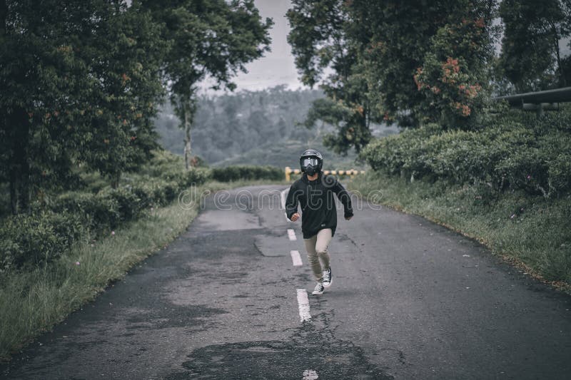 People with Helmets on the Road Stock Image - Image of green, nature ...