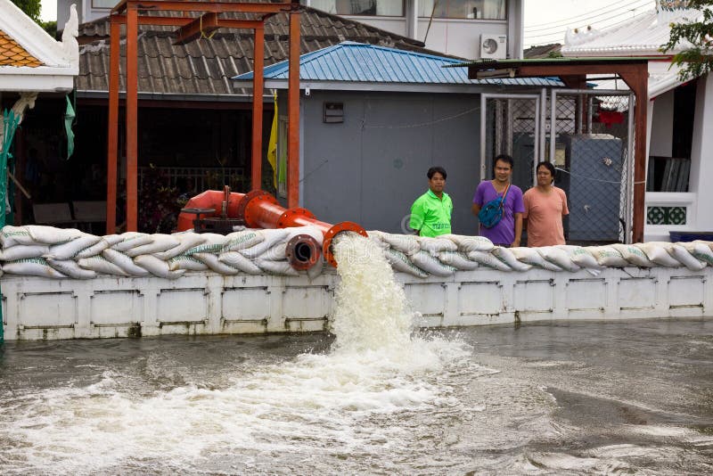 People Helping To Drain the Water Editorial Photo - Image of climate ...
