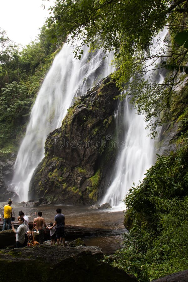 People under waterfall editorial image. Image of water - 57686190