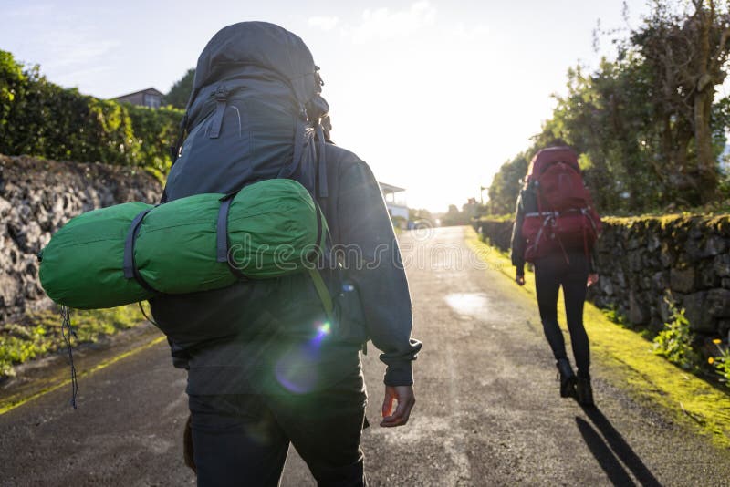 People Hiking with Large Backpacks on a Road in the Azores Stock Image ...