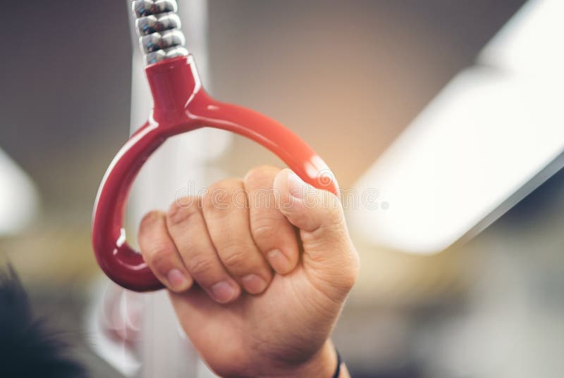 People Holding Hand Onto a Handle on a Train Stock Image - Image of ...