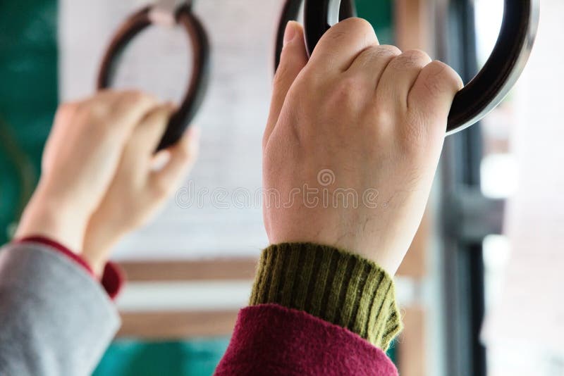 People Holding Onto a Handle Stock Photo - Image of fingers, handle ...
