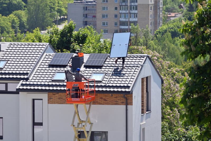 People Installing Solar Panels on the Roof Editorial Photography ...