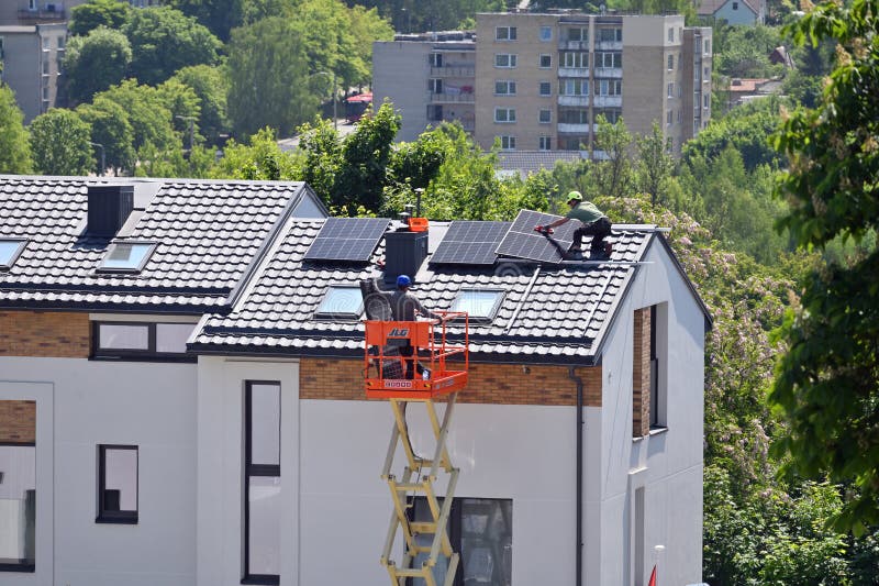 People Installing Solar Panels on the Roof Editorial Image - Image of ...