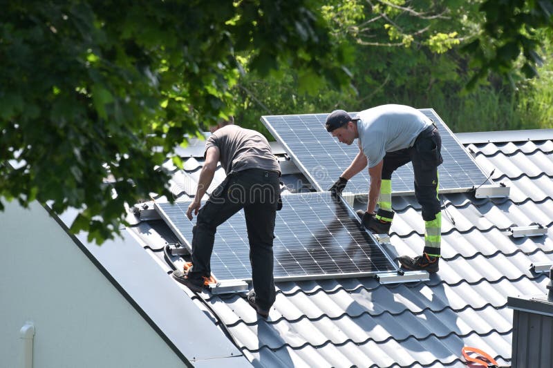 Installing a Solar Cell on a Roof. Stock Image - Image of installation ...