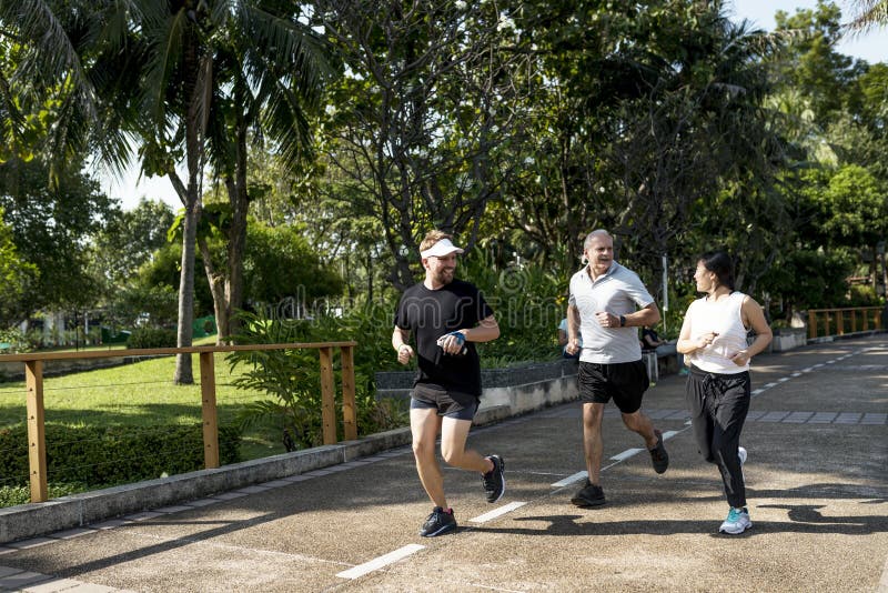 People Jogging at Park Together Stock Photo - Image of park, devotion ...