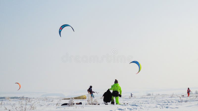 People Kiting in Winter in Snowy Terrain. Snowkiting Stock Photo ...