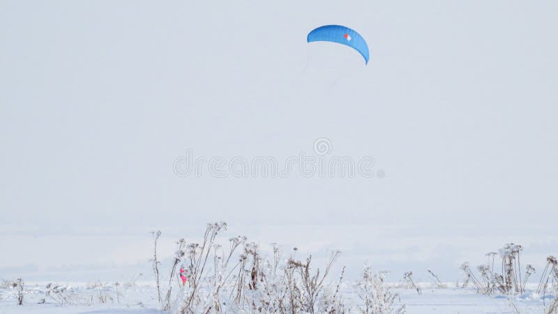 People Kiting in Winter in Snowy Terrain. Snowkiting Stock Photo ...